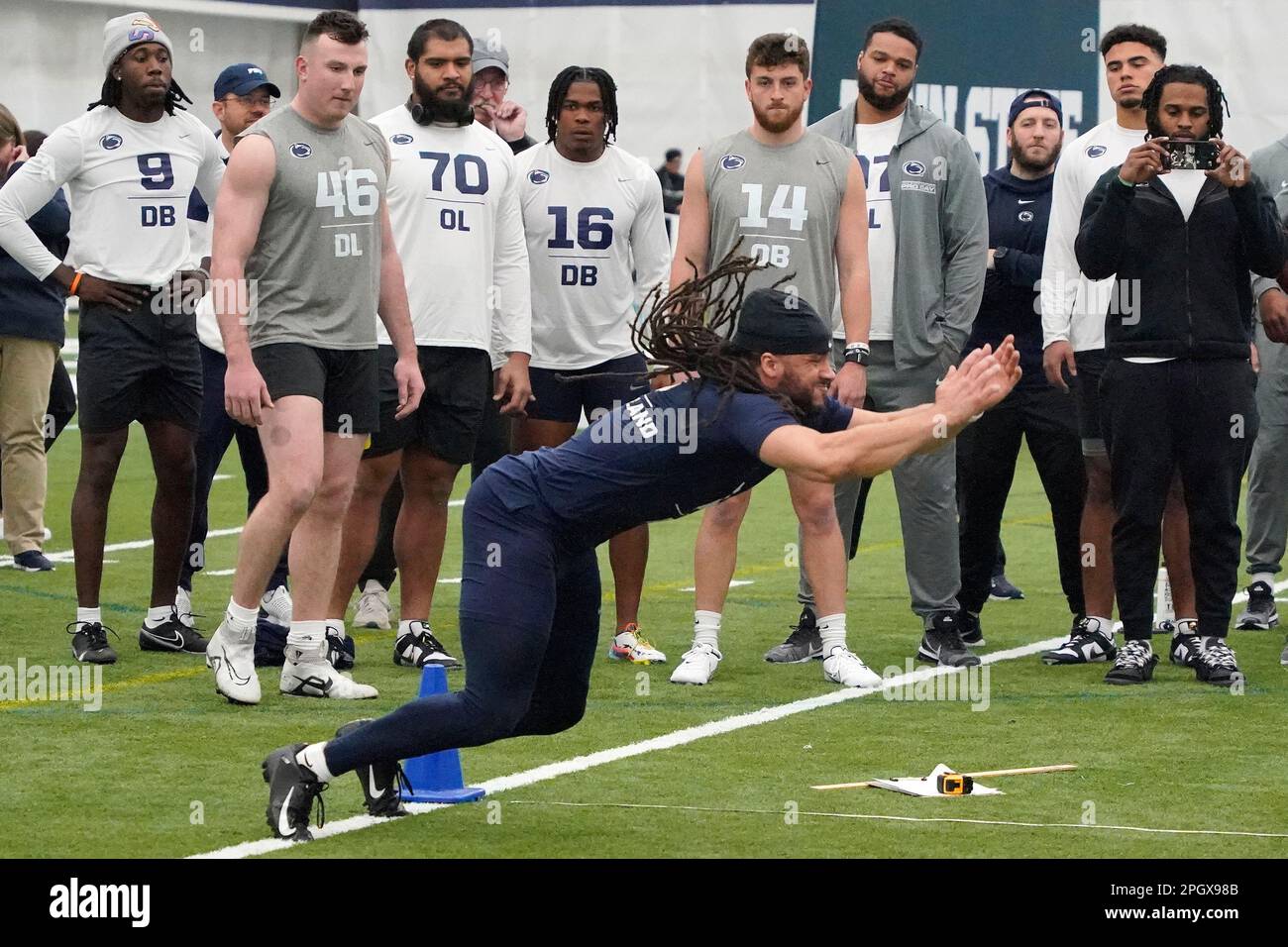 Defensive back Jonathan Sutherland begins his take off in the broad ...