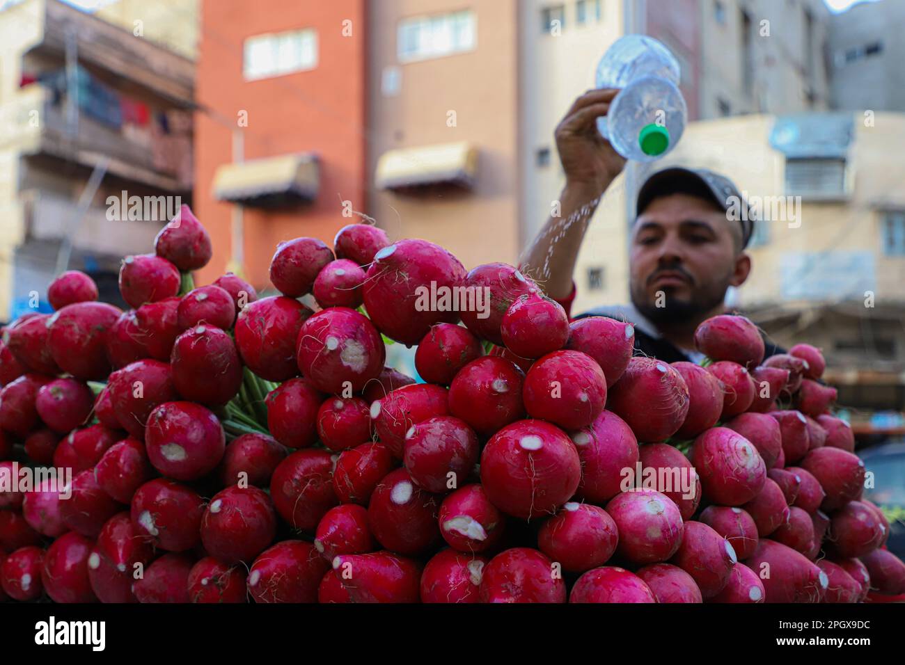 Gaza. 24th Mar, 2023. A Palestinian vendor sells vegetables during ...