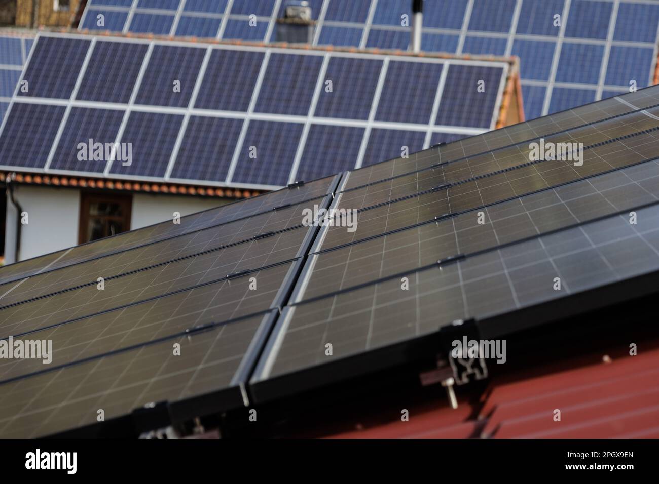 Photovoltaic modules on house roofs Stock Photo - Alamy