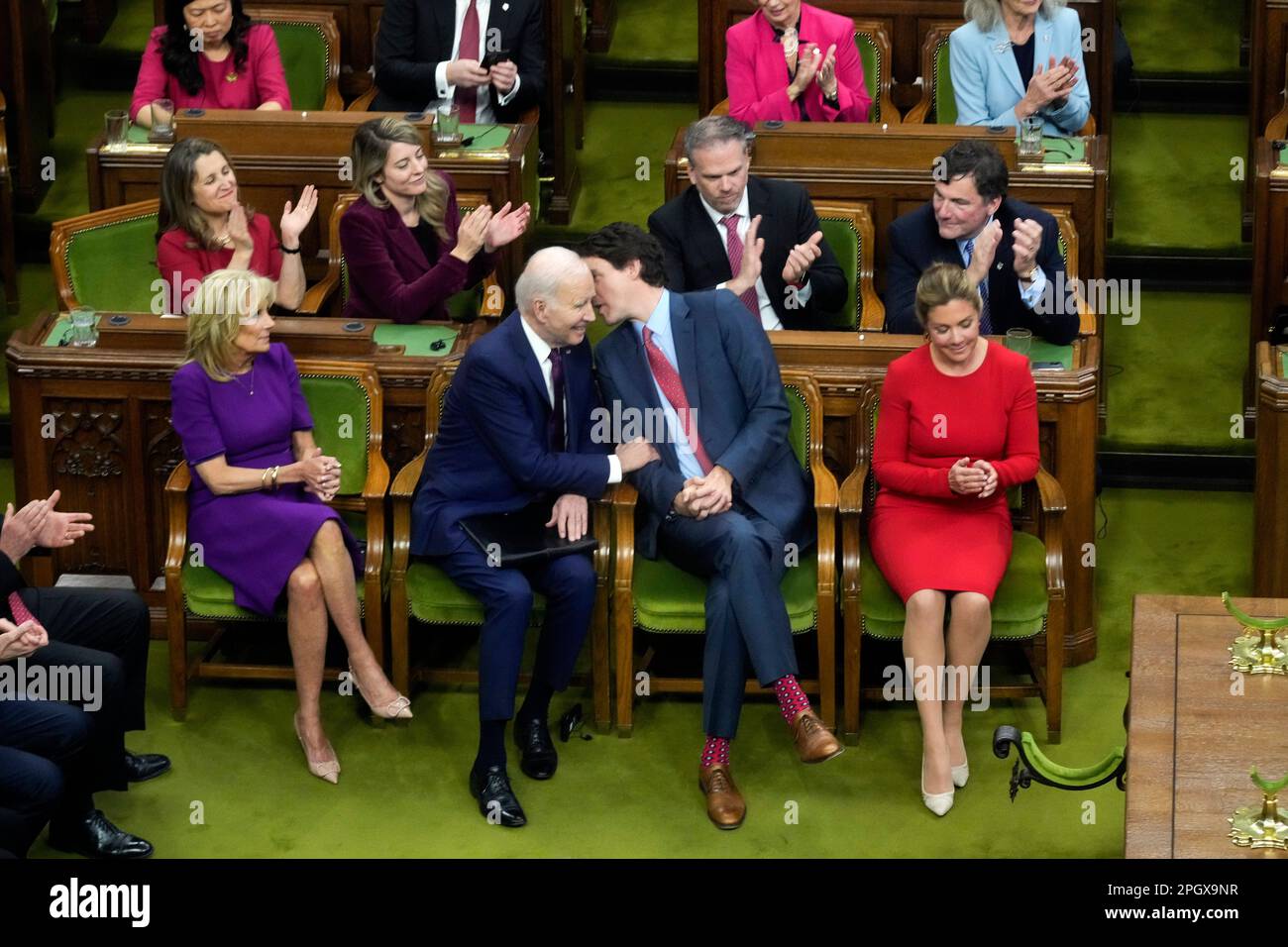 Canadian Prime Minister Justin Trudeau talks with President Joe Biden ...
