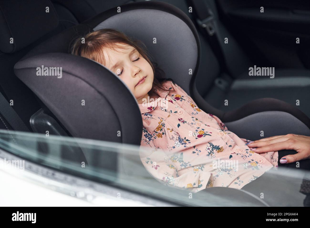 Cute little girl sleeping inside of the car. Conception of traveling ...
