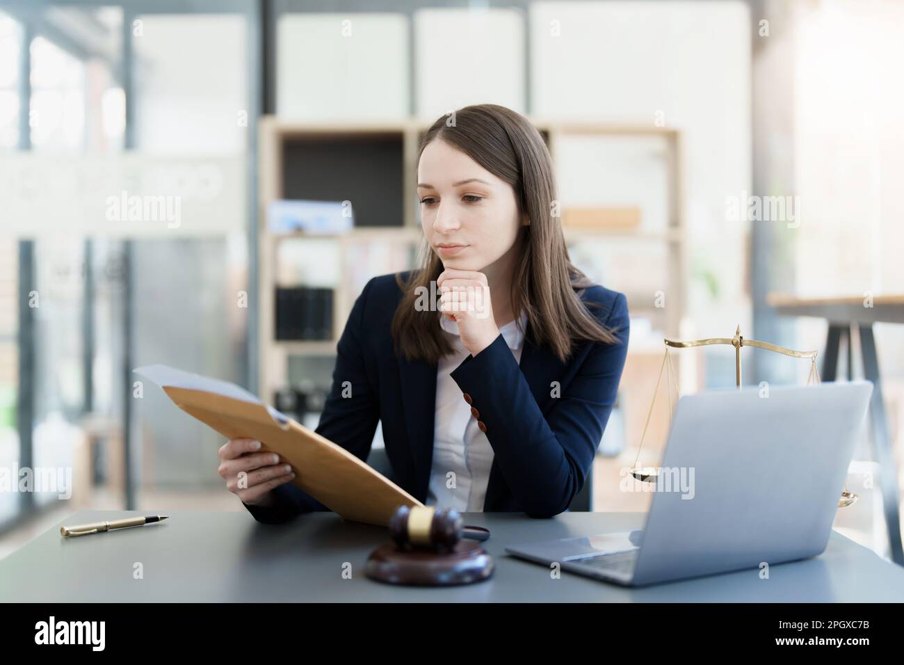 Portrait of a Asian woman lawyer studying a lawsuit for a client before ...
