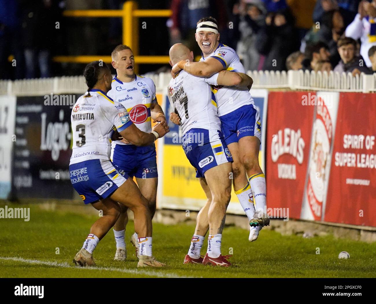 Warrington Wolves' George Williams (right) celebrates scoring their ...
