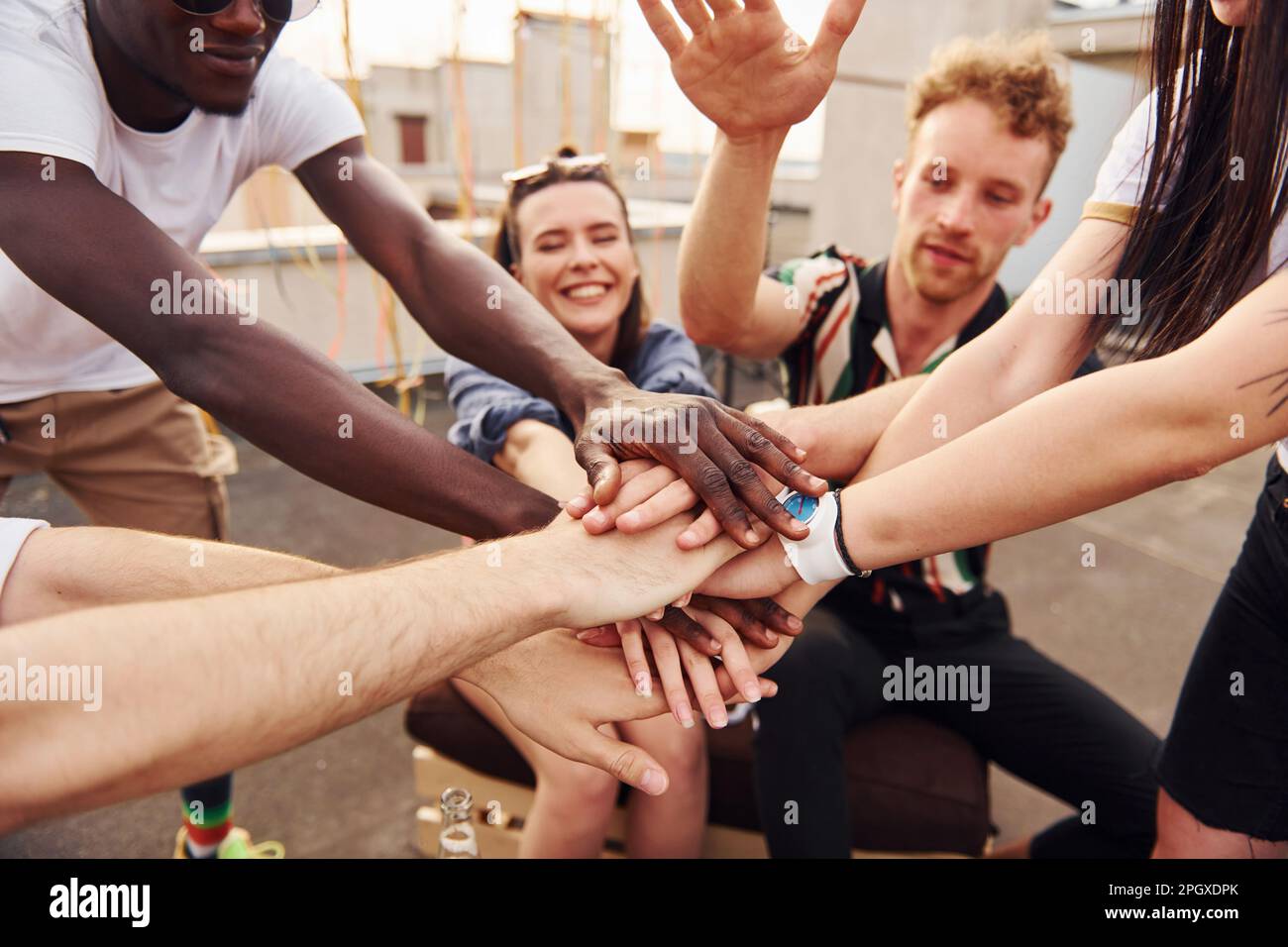 Unity of people. Group of young people in casual clothes have a party ...