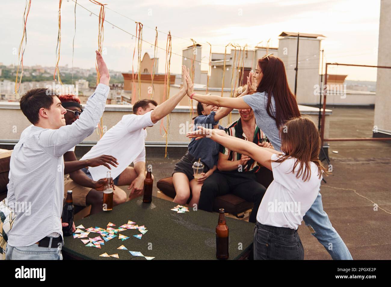 Unity of people. Group of young people in casual clothes have a party ...