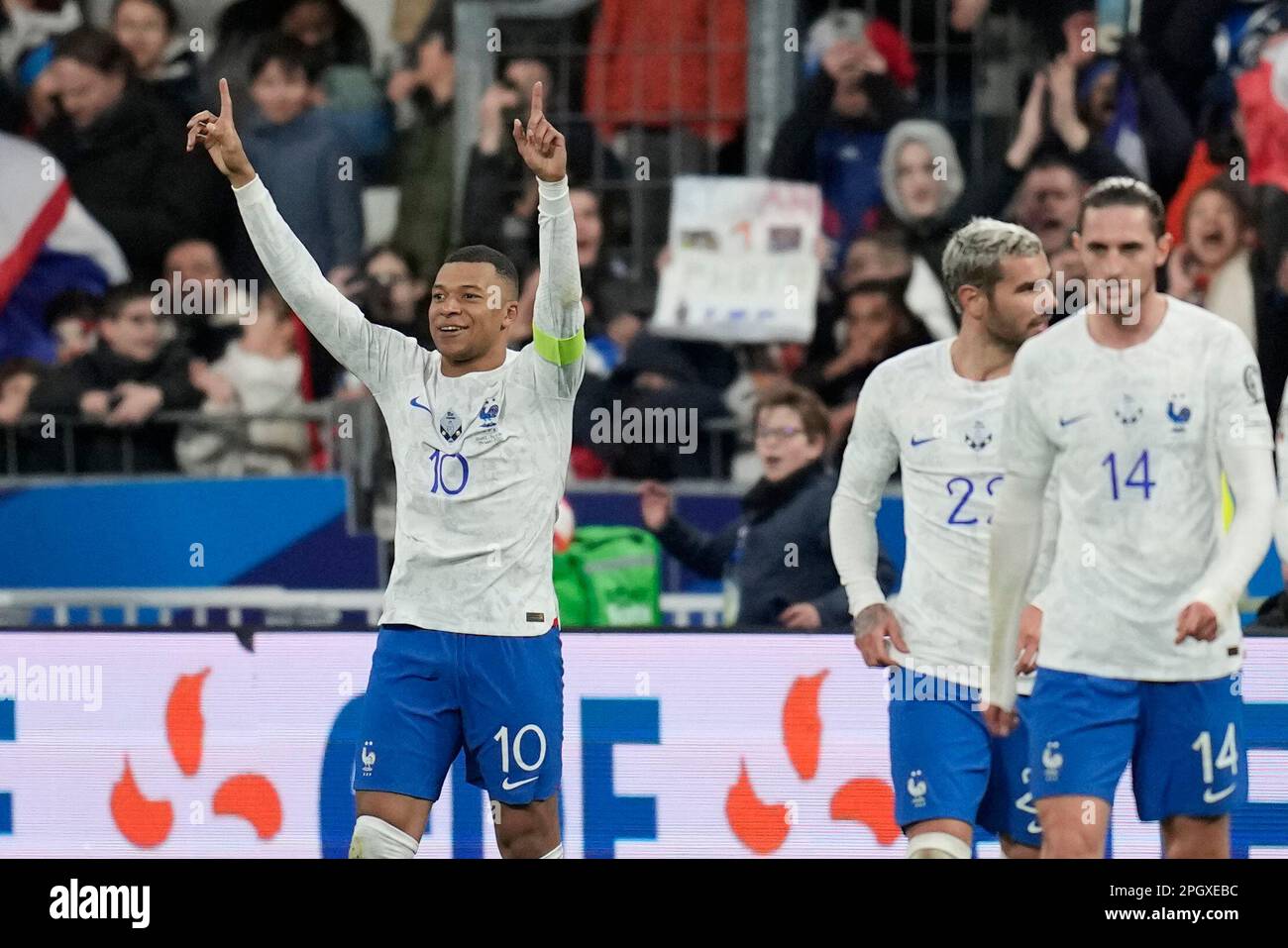 France's Kylian Mbappe, left, celebrates after scoring his side's ...