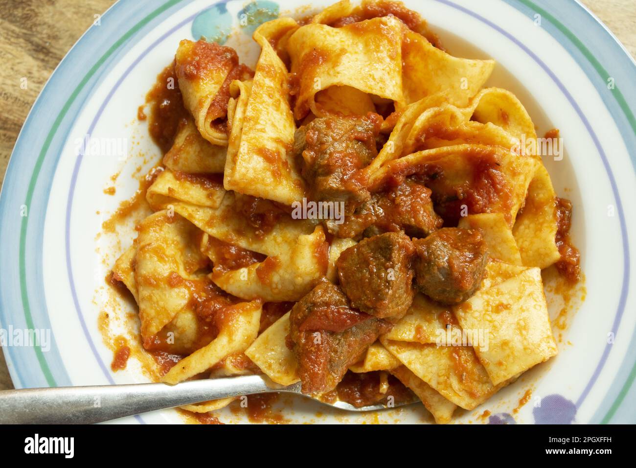 Handmade egg pappardelle with red wild boar ragout Stock Photo - Alamy