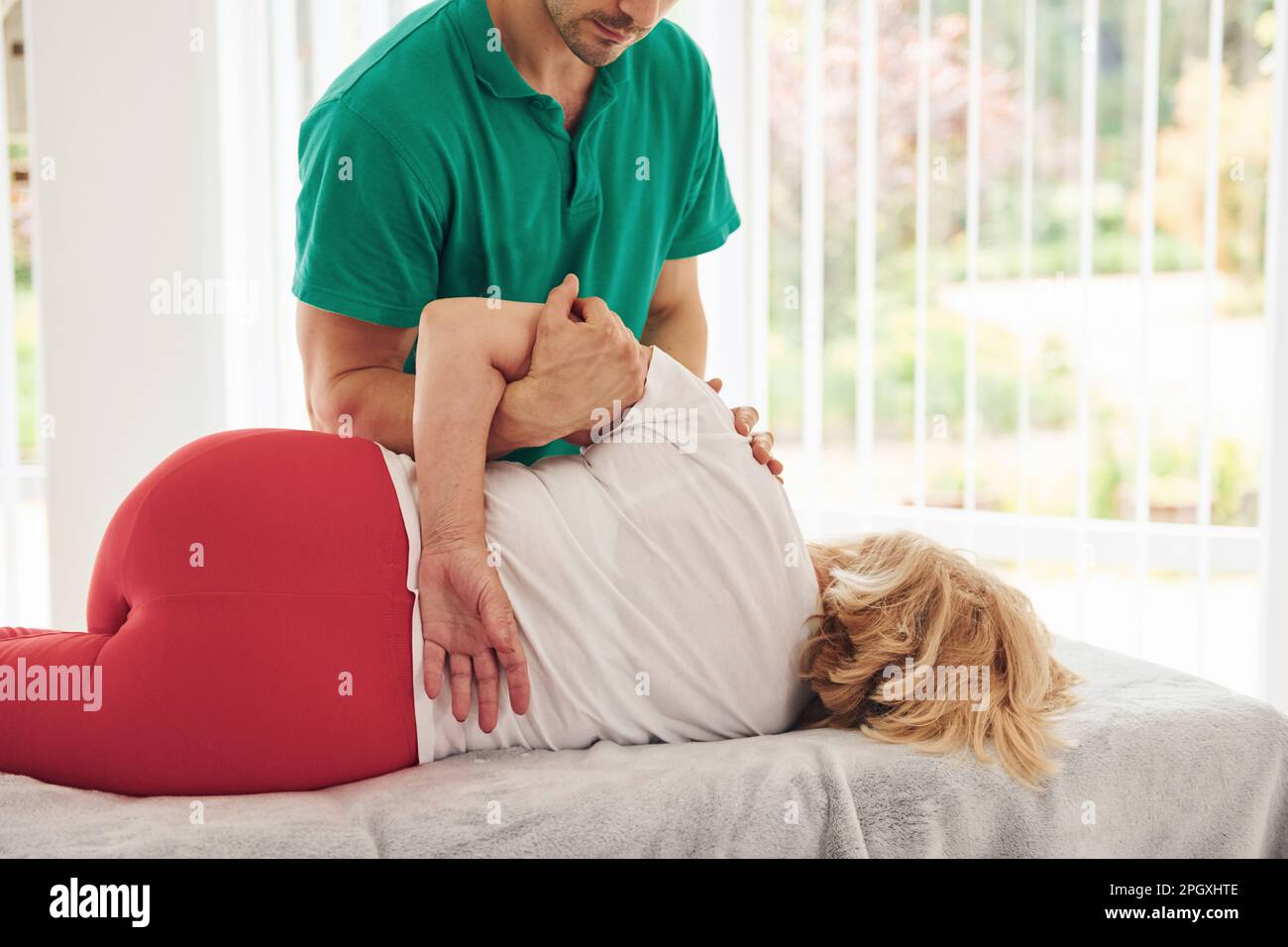 Older woman have a visit in clinic, lying down and having ...