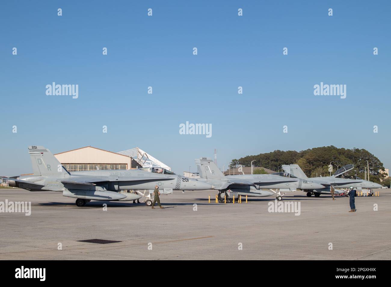 U.S. Marines with Marine Fighter Attack Squadron (VMFA) 312, return ...