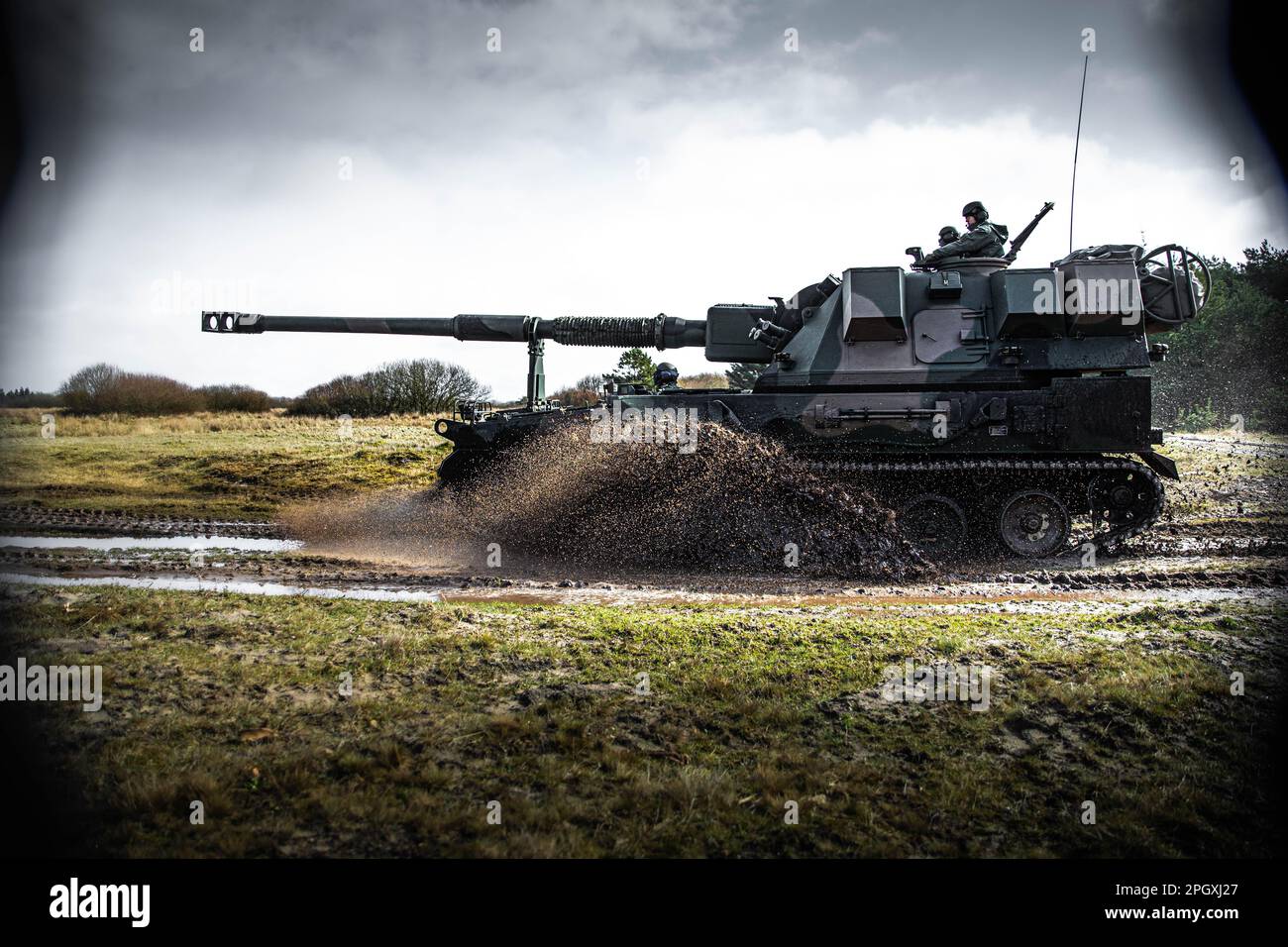 Polish soldiers assigned to the Multinational Field Artillery Brigade ...