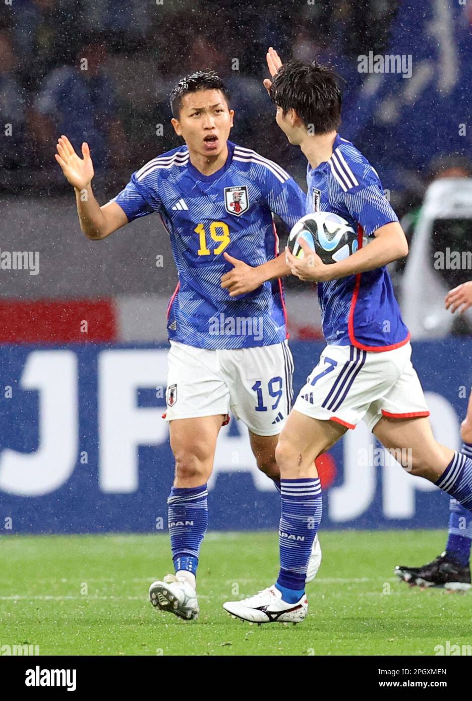 Tokyo, Japan. 24th Mar, 2023. Japan's Takuma Nishimura (L) is celebrated from his teammate Ao ...