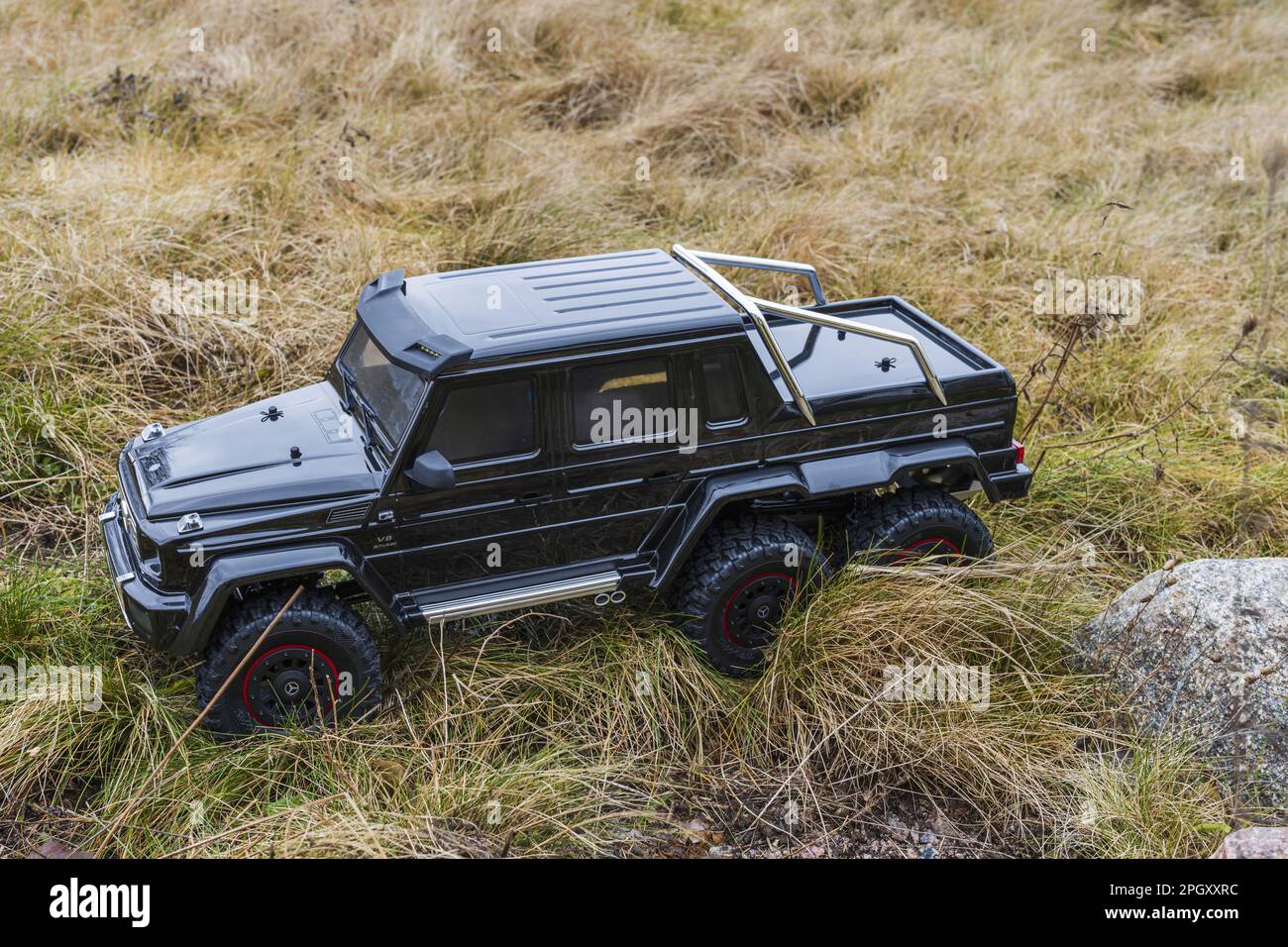 View of radio controlled model Mercedes Benz racing car on off-road ...