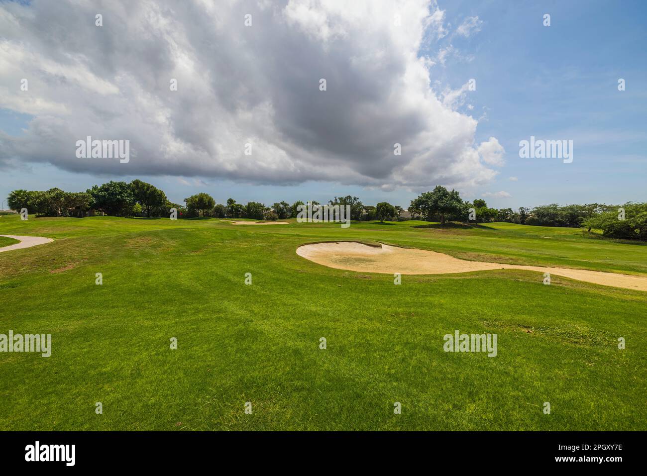 Beautiful view of green grass golf course on island of Aruba against ...