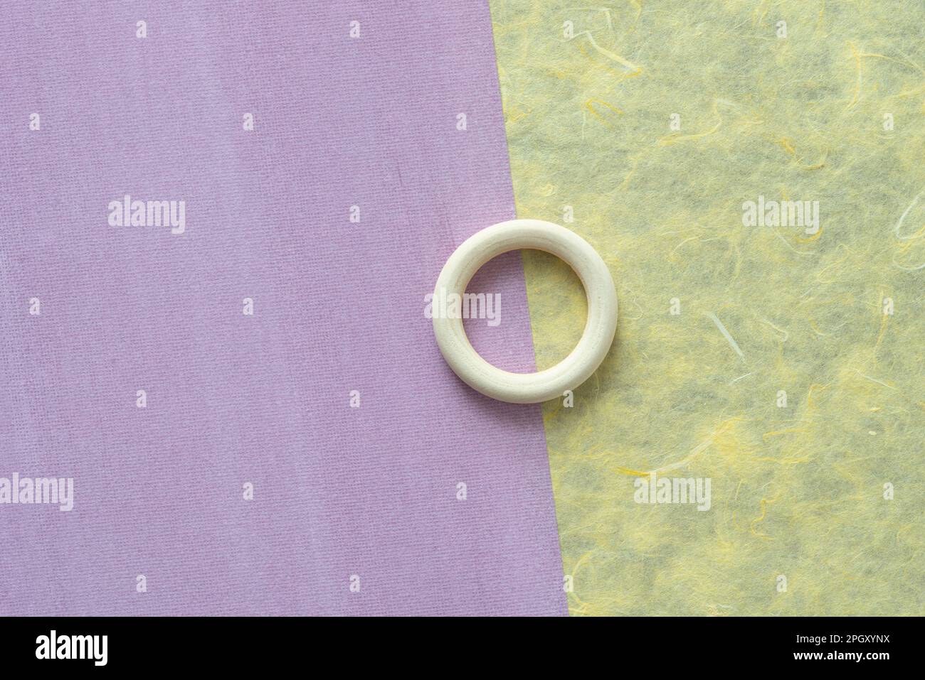 wooden shape on scrapbook and textured tissue paper background Stock ...