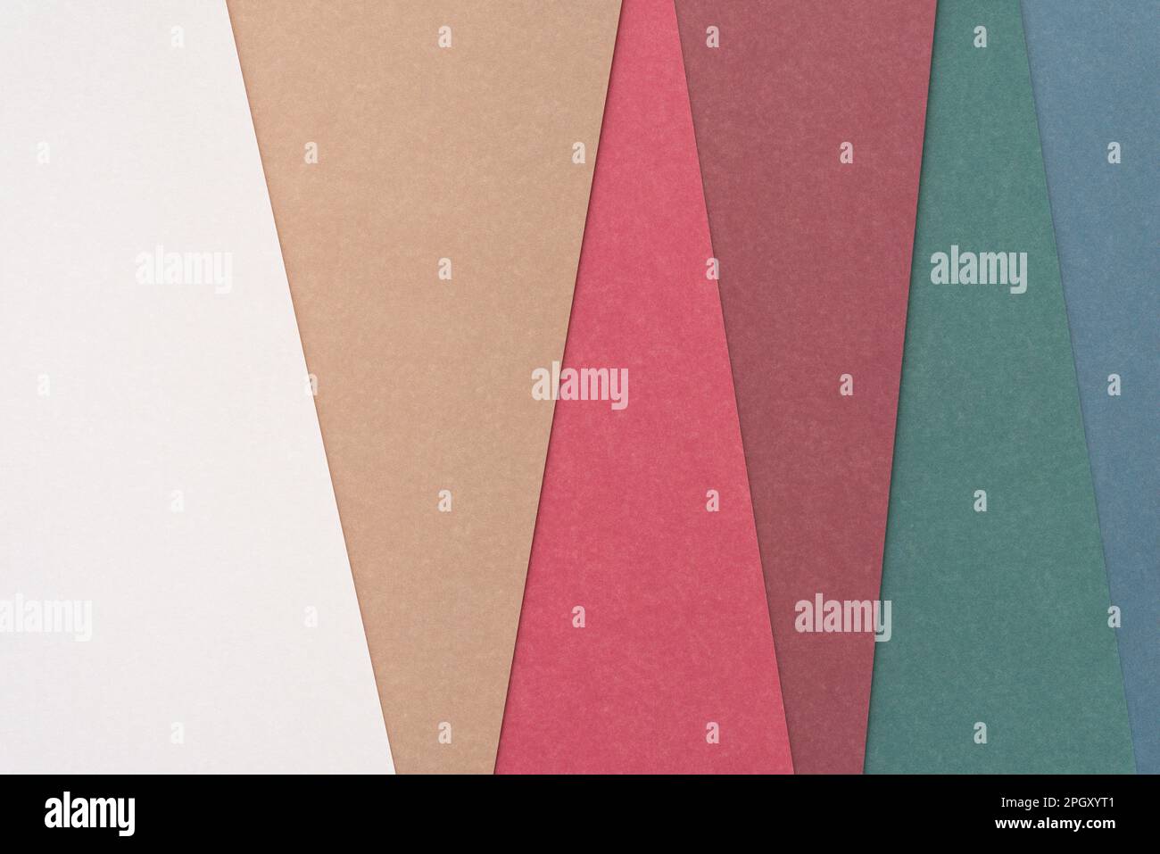 scrapbook paper background featuring layered sheets in various colours ...