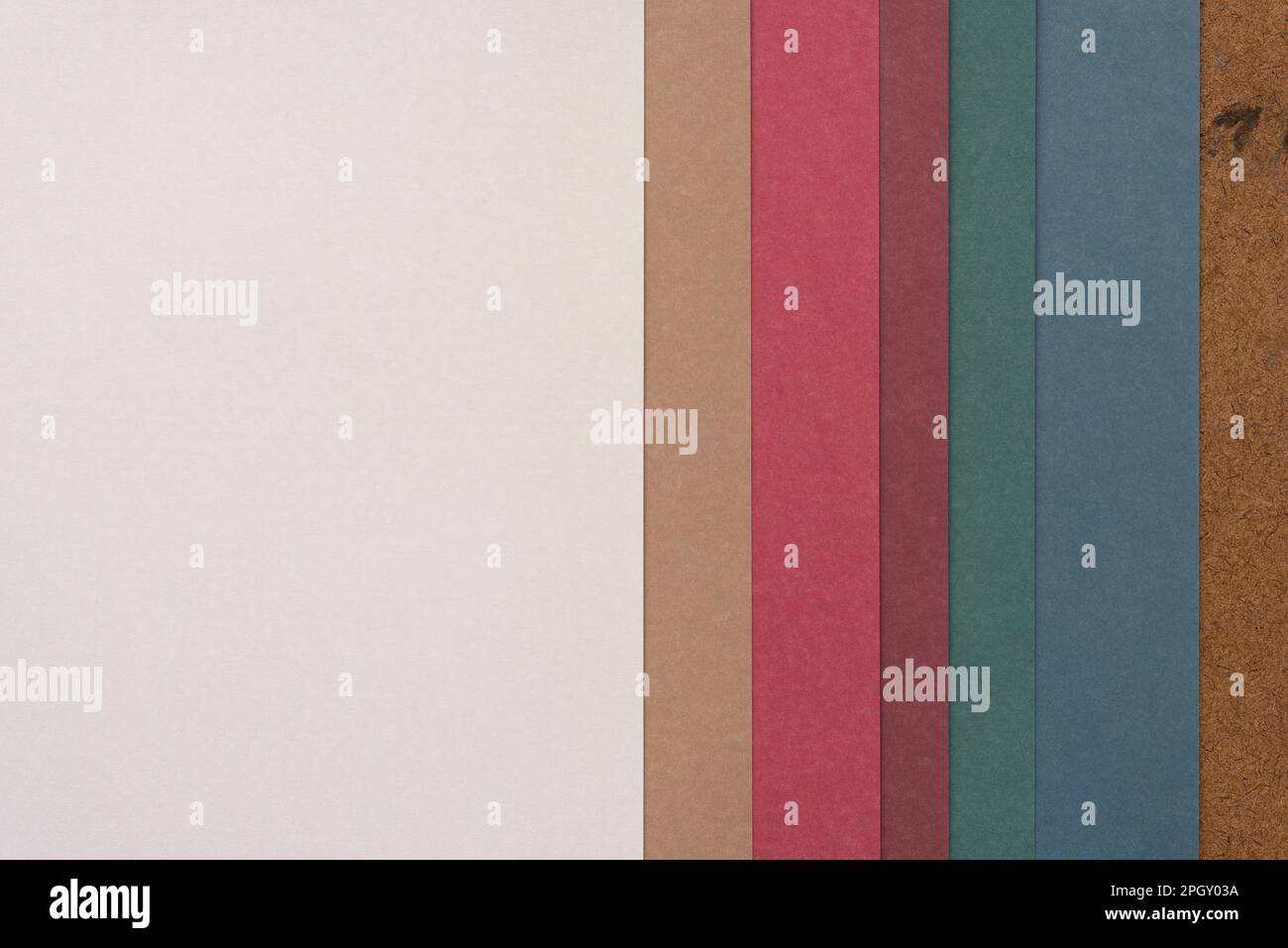 scrapbook paper background featuring layered sheets in various colours ...