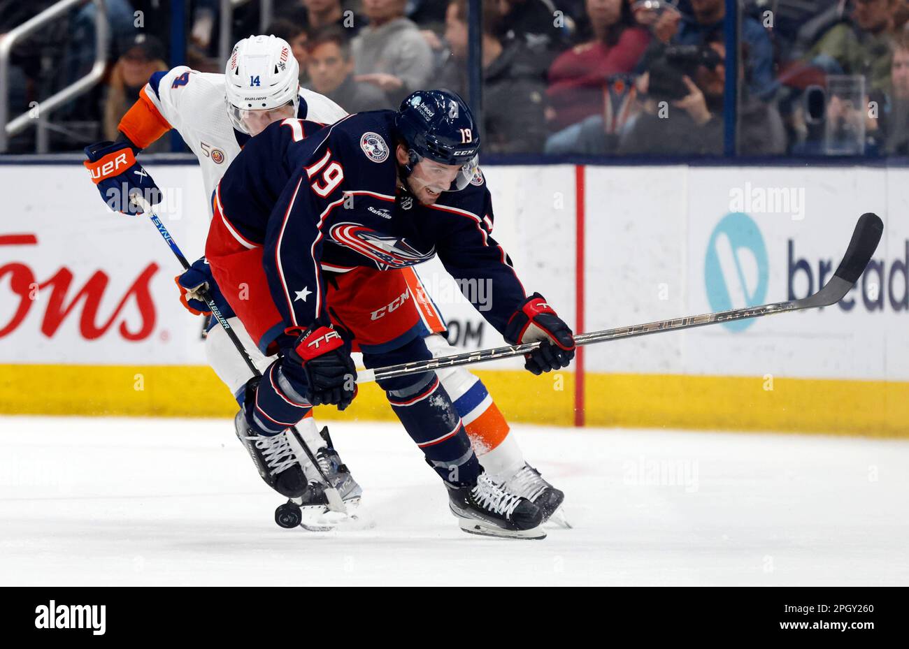 Columbus Blue Jackets forward Liam Foudy, right, chases the puck in ...
