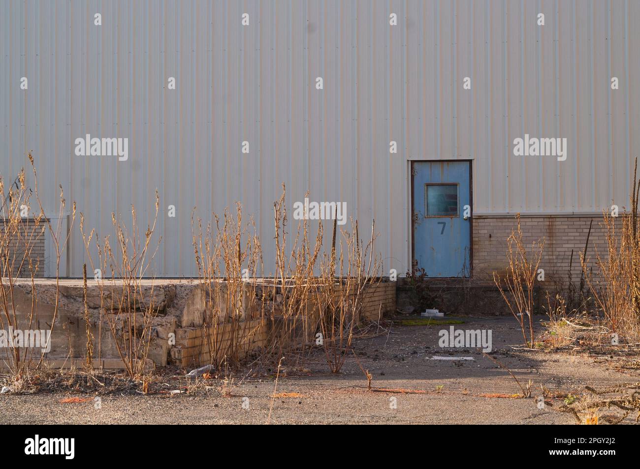 Abandoned factory, side door freight entrance Stock Photo - Alamy