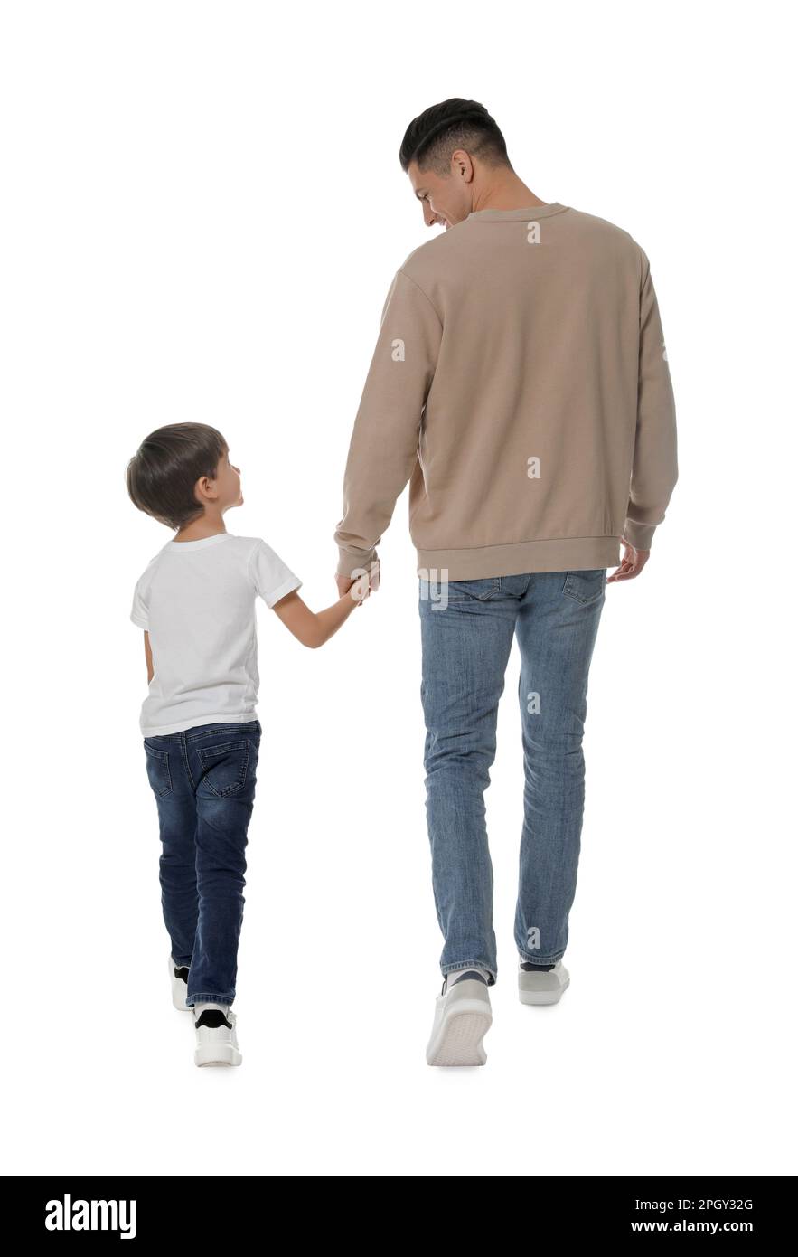 Little boy with his father on white background, back view Stock Photo ...