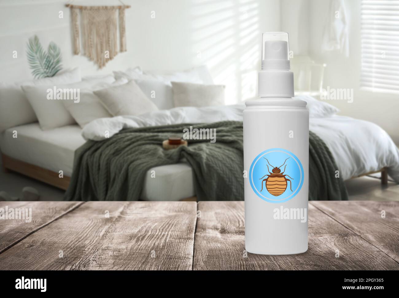 Anti bed bug spray on wooden table in bedroom. Space for text Stock ...