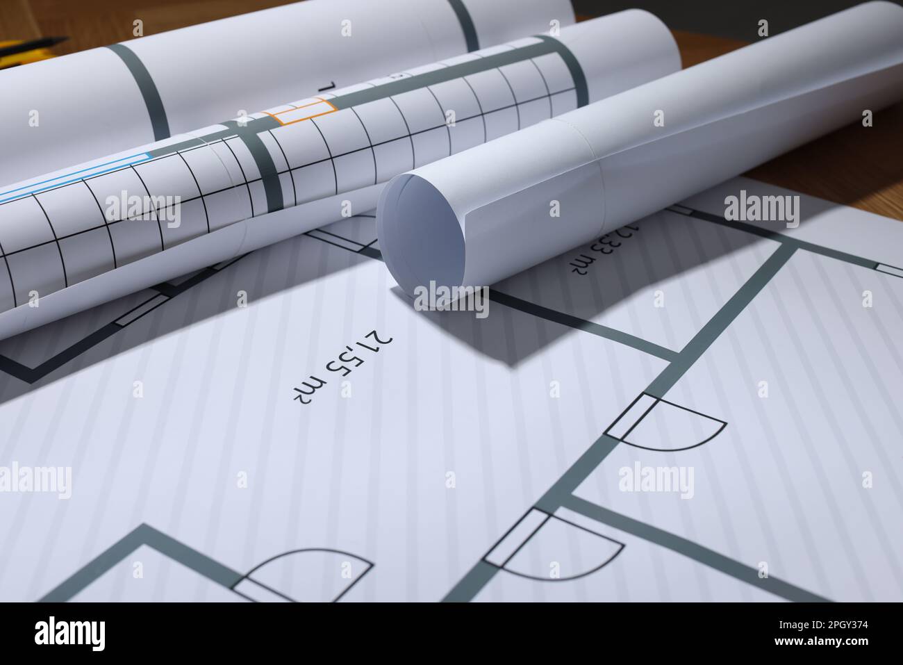 Many construction drawings on table, closeup view Stock Photo - Alamy