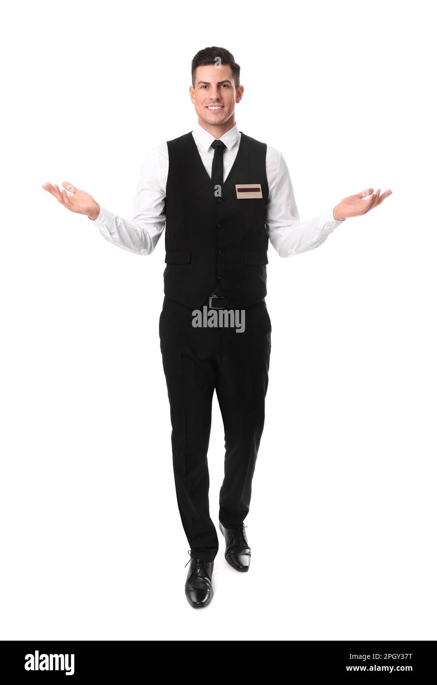 Full length portrait of happy receptionist in uniform on white ...