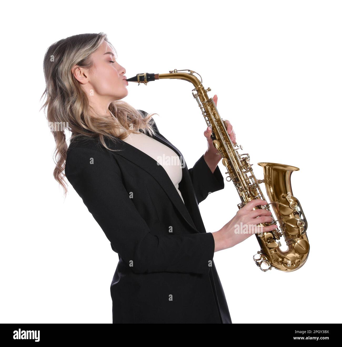 Beautiful young woman in elegant suit playing saxophone on white ...