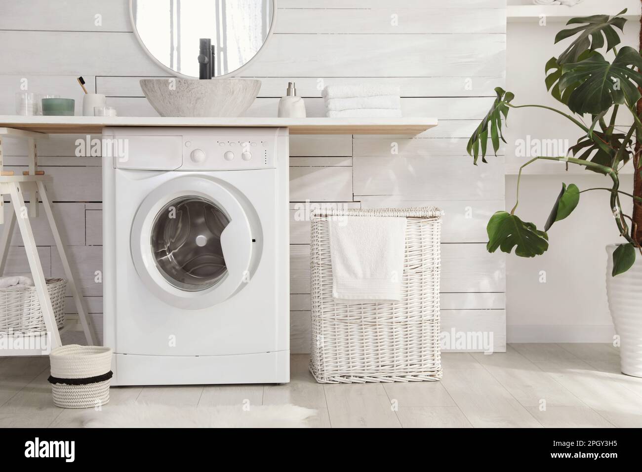 Stylish bathroom interior with modern washing machine Stock Photo - Alamy