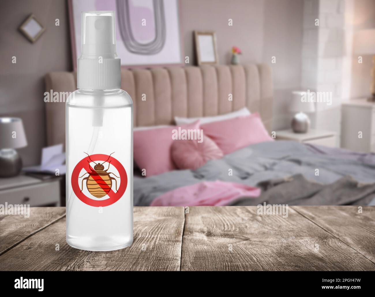 Anti bed bug spray on wooden table in bedroom. Space for text Stock ...