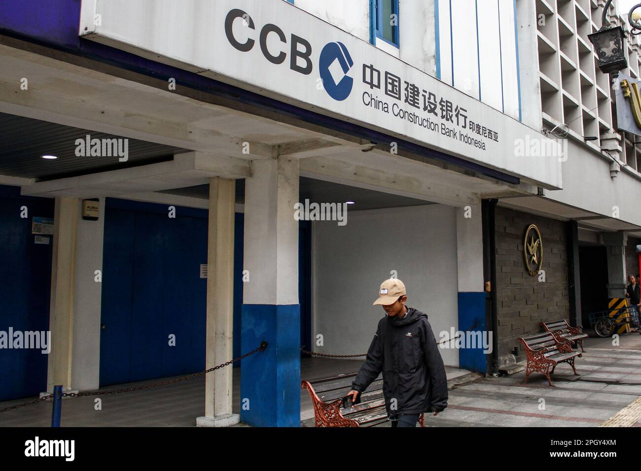 Bandung, West Java, Indonesia. 25th Mar, 2023. A man walk past a China ...