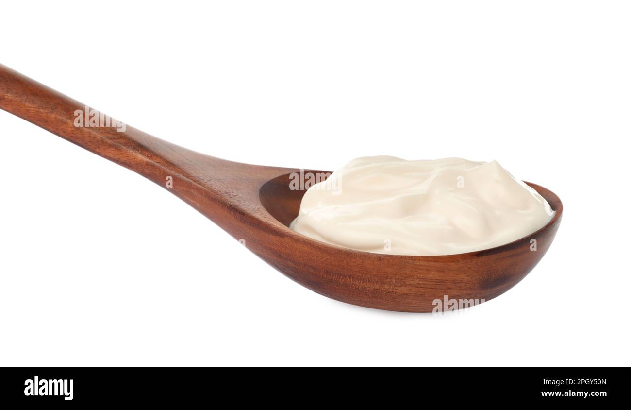 Wooden spoon with tasty mayonnaise isolated on white Stock Photo - Alamy