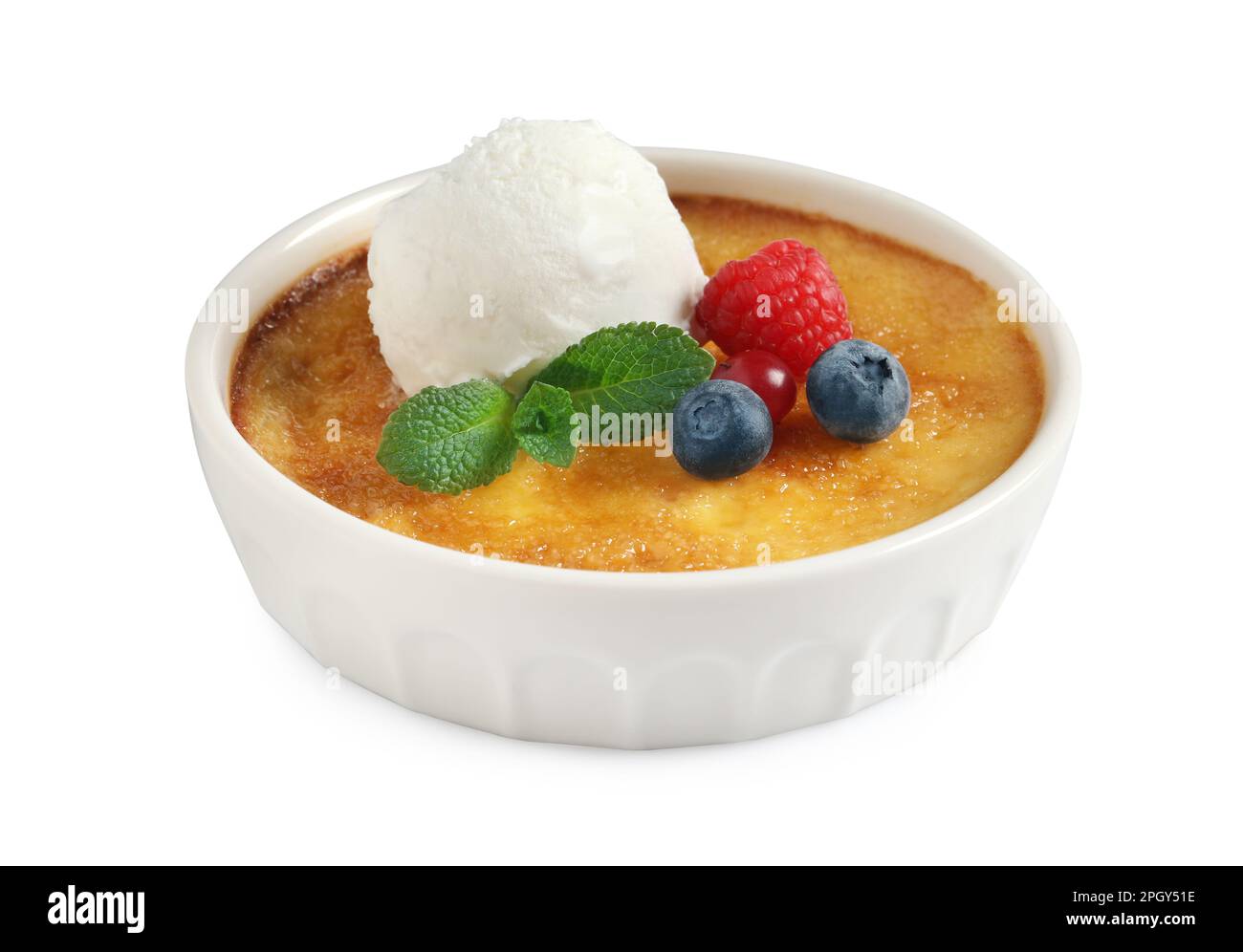 Delicious creme brulee with scoop of ice cream, fresh berries and mint ...