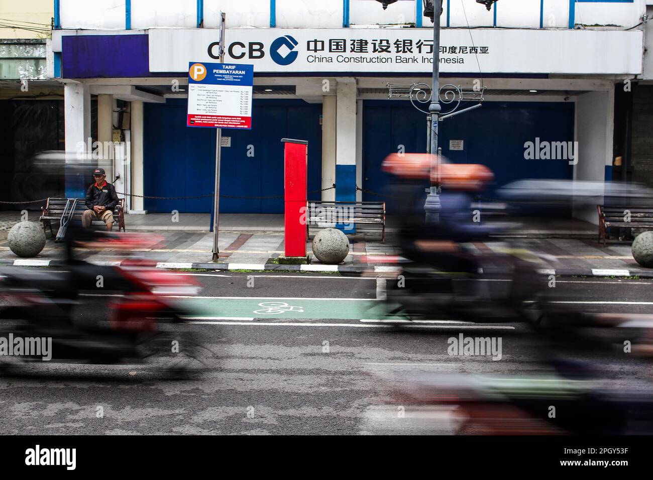 Bandung, West Java, Indonesia. 25th Mar, 2023. Motorcycle past a China ...