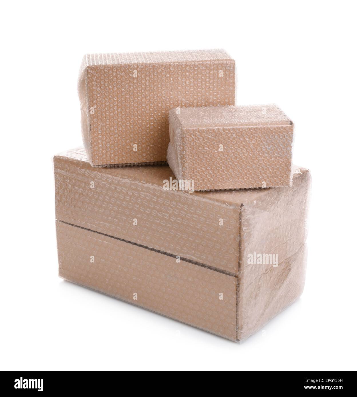 Cardboard boxes packed in bubble wrap on white background Stock Photo ...