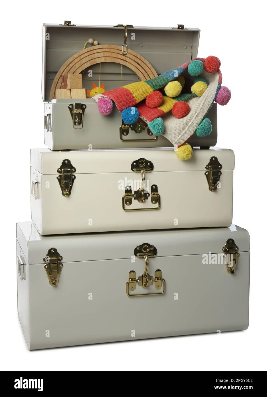 Stylish storage trunks with child's accessories on white background ...