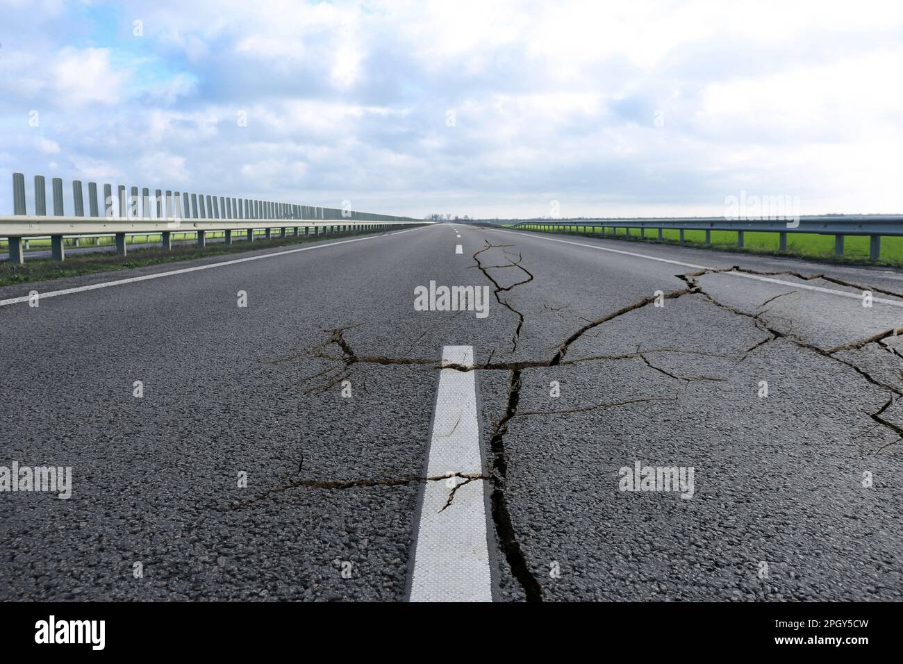 Large cracks on asphalt road after earthquake Stock Photo - Alamy
