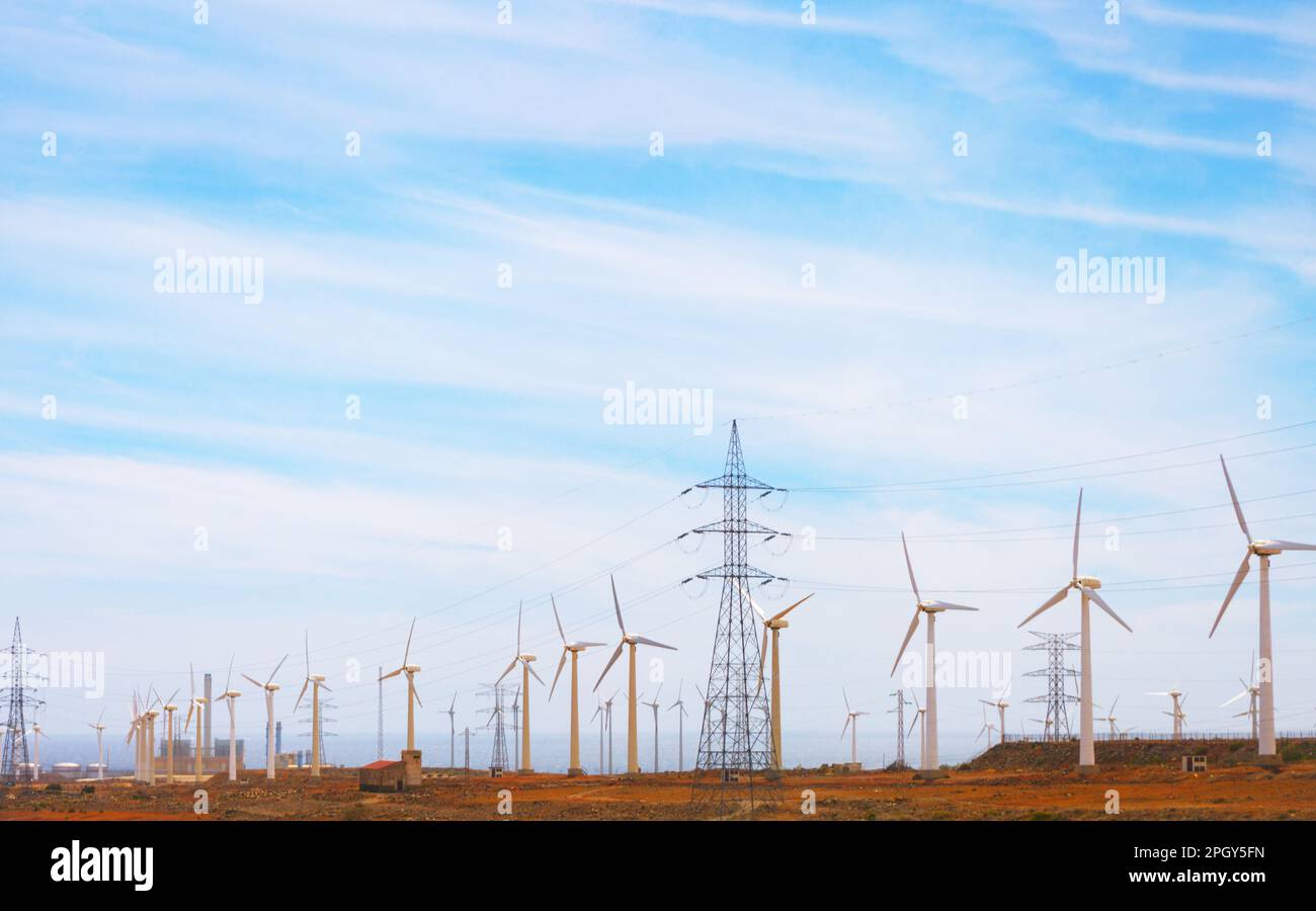 Wind farm with wind turbines and high voltage wires Stock Photo - Alamy