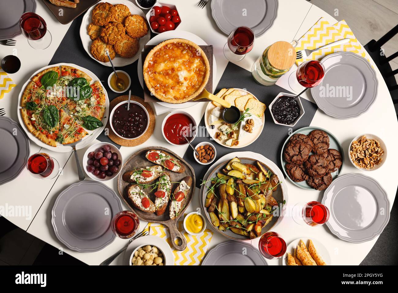 Brunch table setting with different delicious food indoors, top view ...