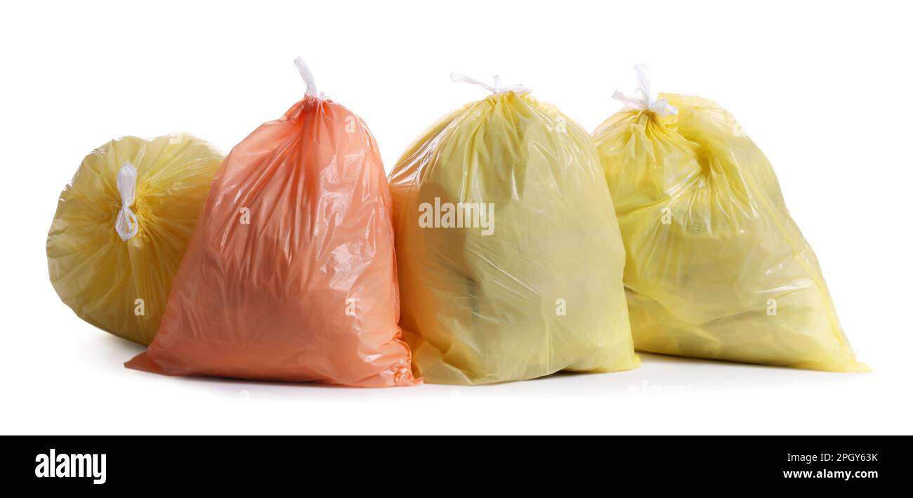 Trash bags full of garbage on white background Stock Photo - Alamy
