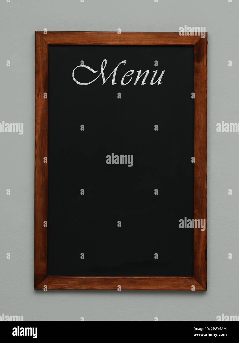 Black chalkboard with word Menu on light grey background. Mockup for ...