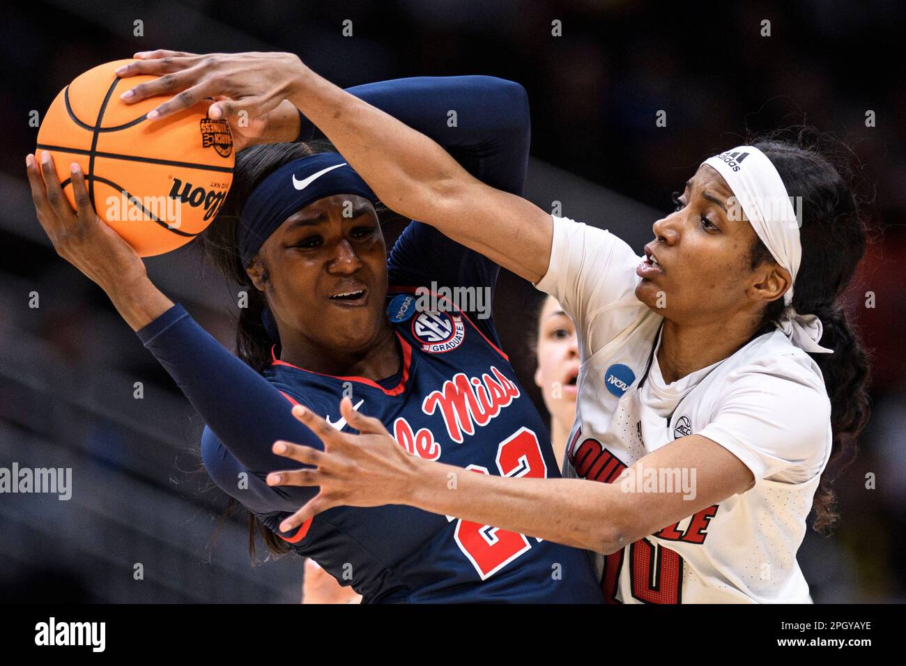Louisville guard Morgan Jones (24) attempts to strip the basketball ...