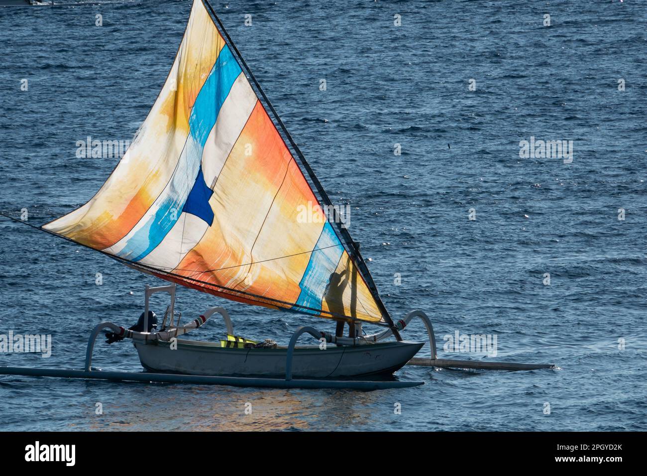Jukung fishing boats sailing back to beach in Amed, Bali, Indonesia ...