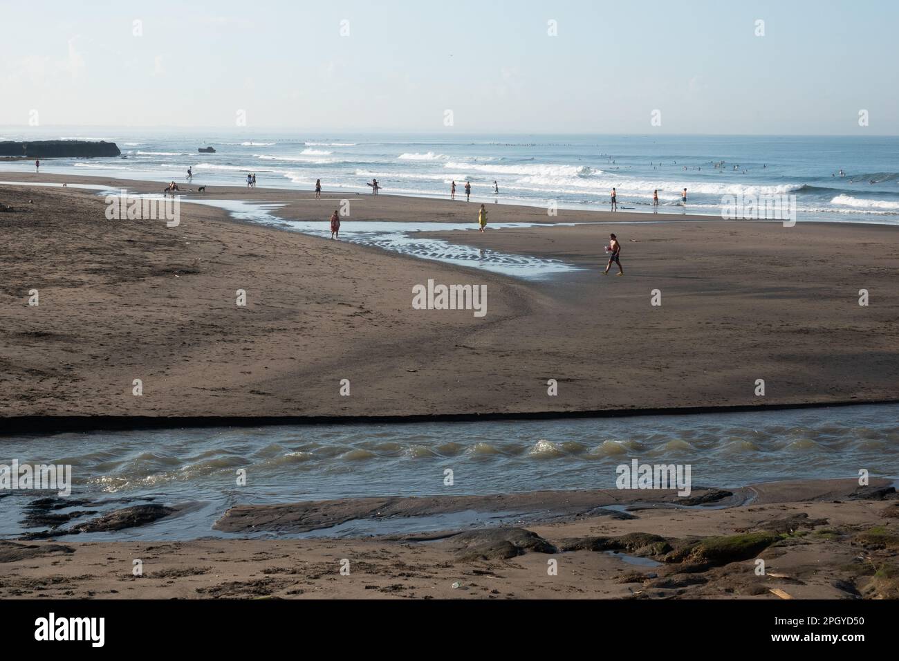 Early morning surfing crowd at popular Canggu beach, Bali, Indonesia ...