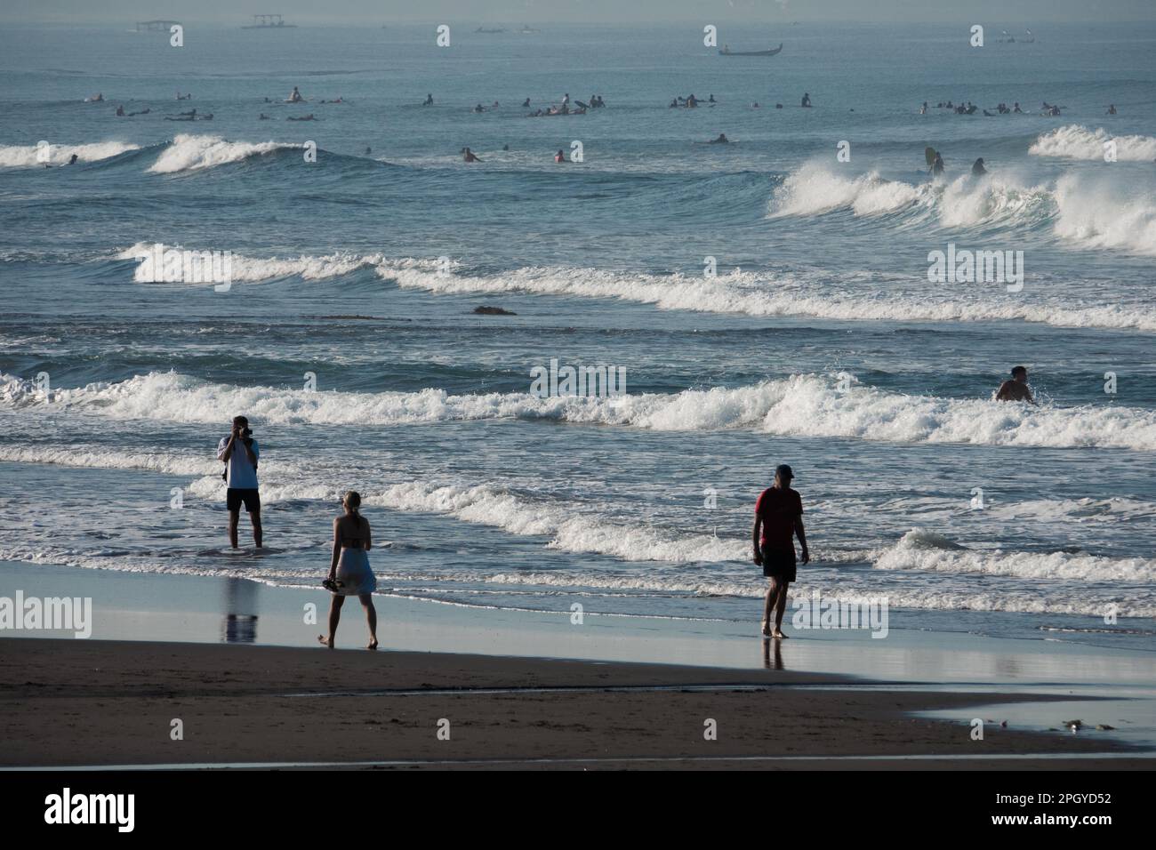 Early morning surfing crowd at popular Canggu beach, Bali, Indonesia ...