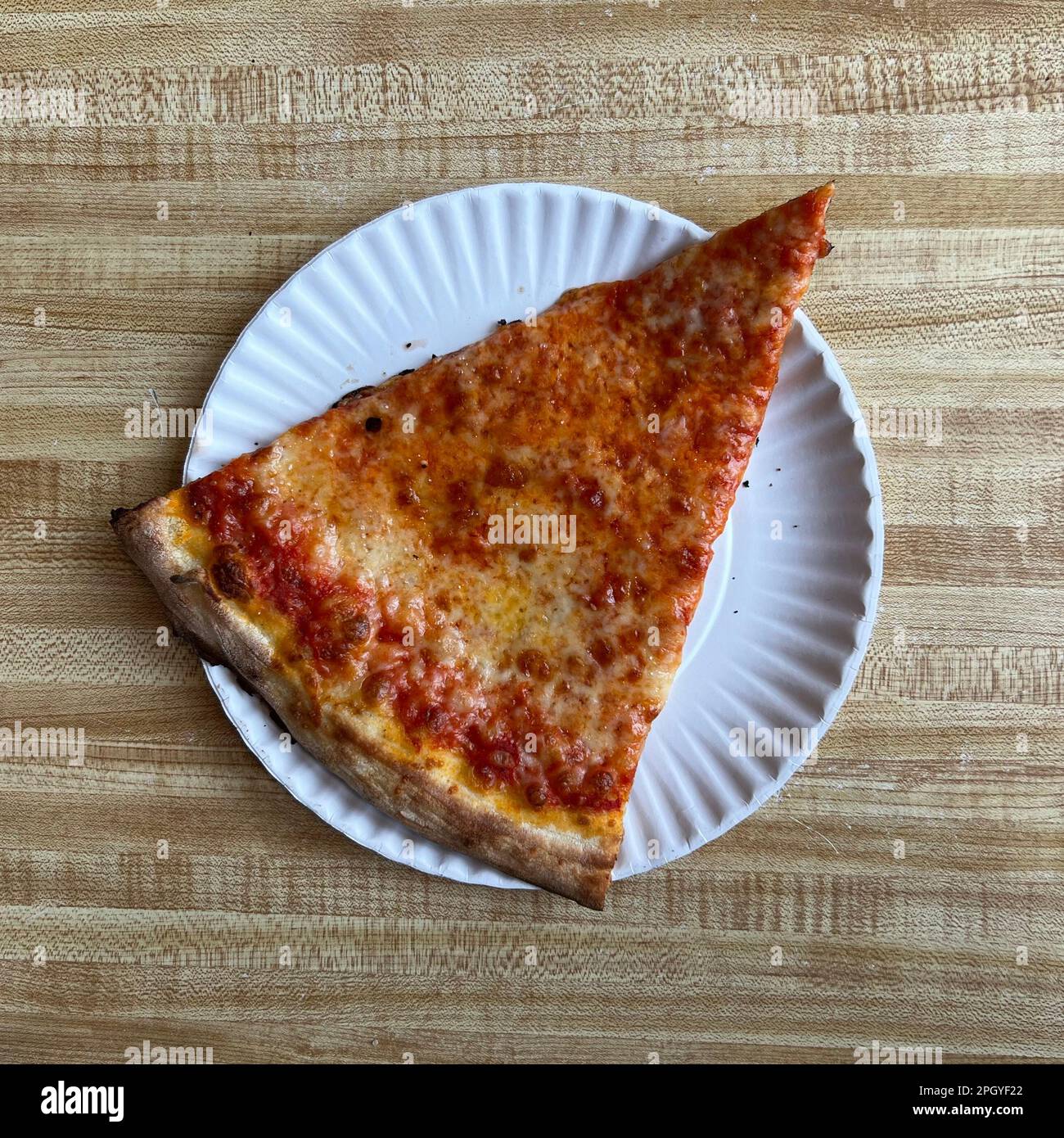 New York, USA. 23rd Mar, 2023. A "cheese slice" pizza slice. Hardly any ...