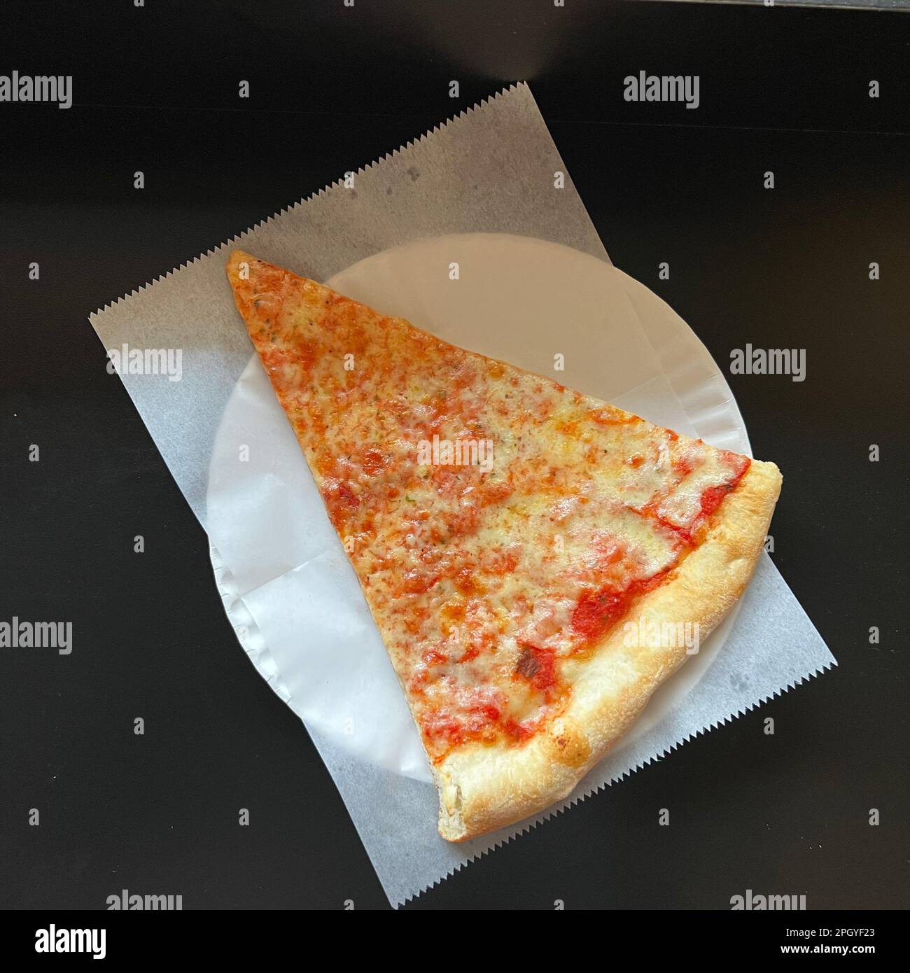 New York, USA. 23rd Mar, 2023. A "cheese slice" pizza slice. Hardly any ...