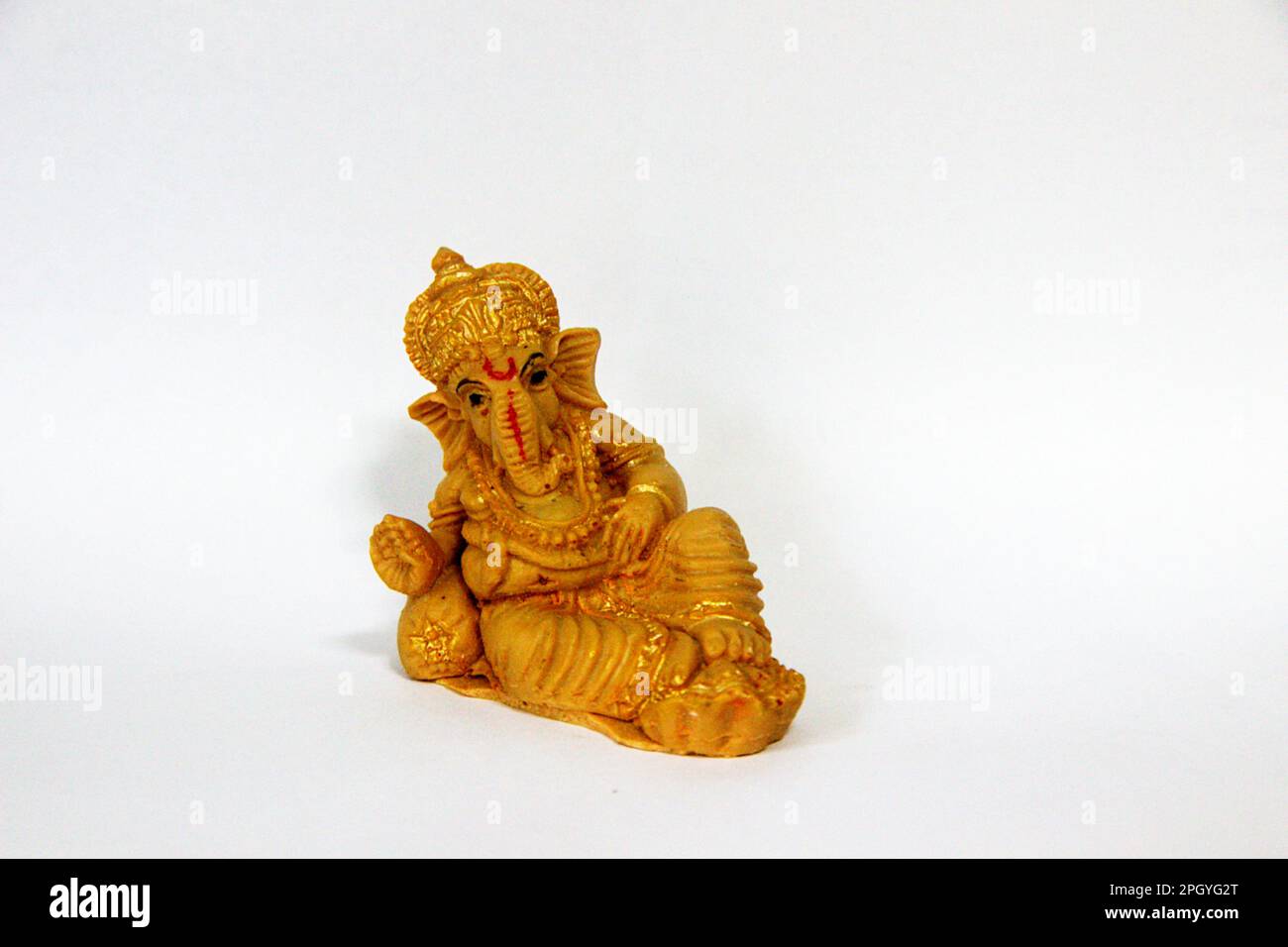 View of idol of Ganesha in reclining and relaxing position against ...