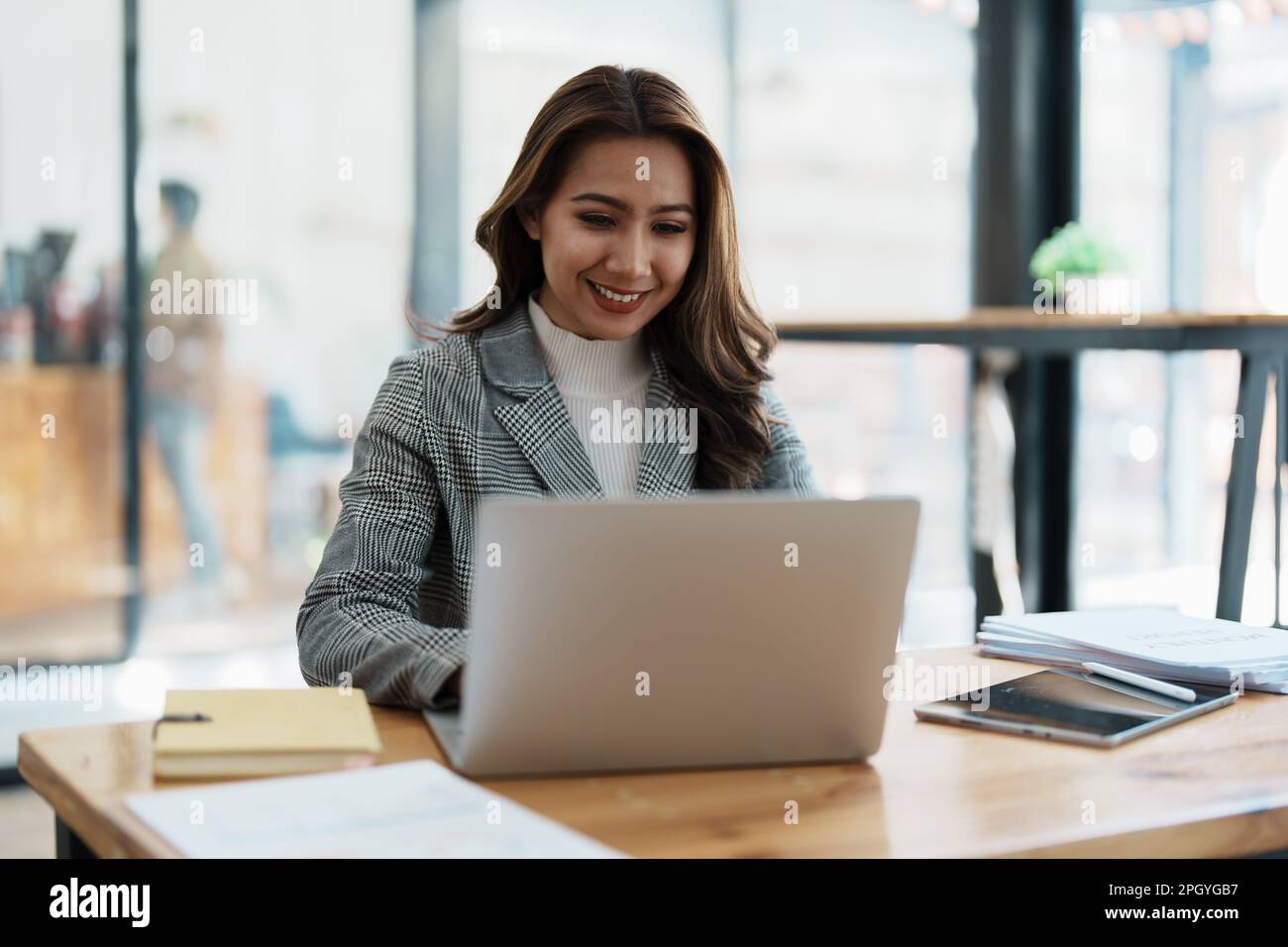 Portrait of a woman business owner showing a happy smiling face as he ...
