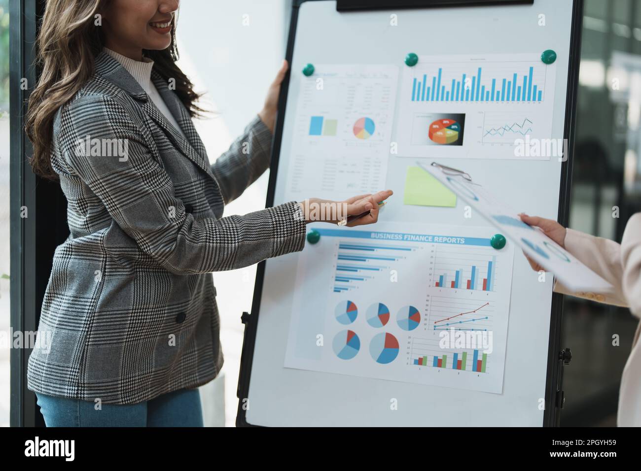 Financial analysts analyzing business reports on planned investment ...
