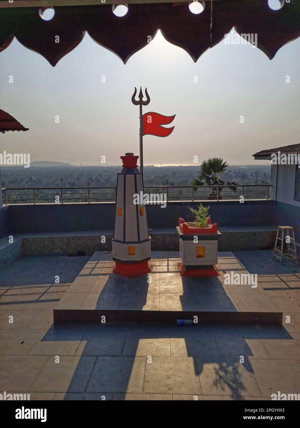 Traditional Hindu symbols at temple of Shiva at Chaul near Alibag state ...
